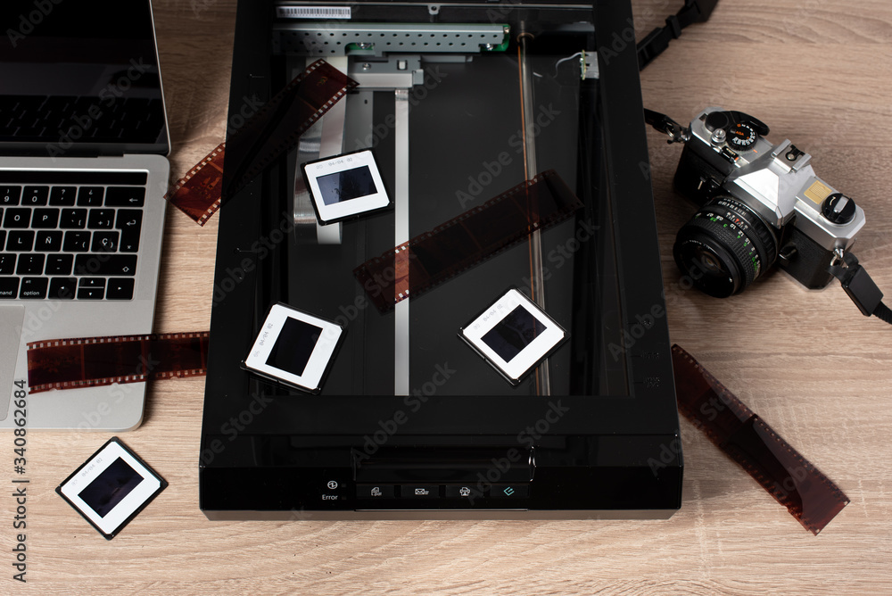 Photography digitalization process. A retro camera, transparencies ...