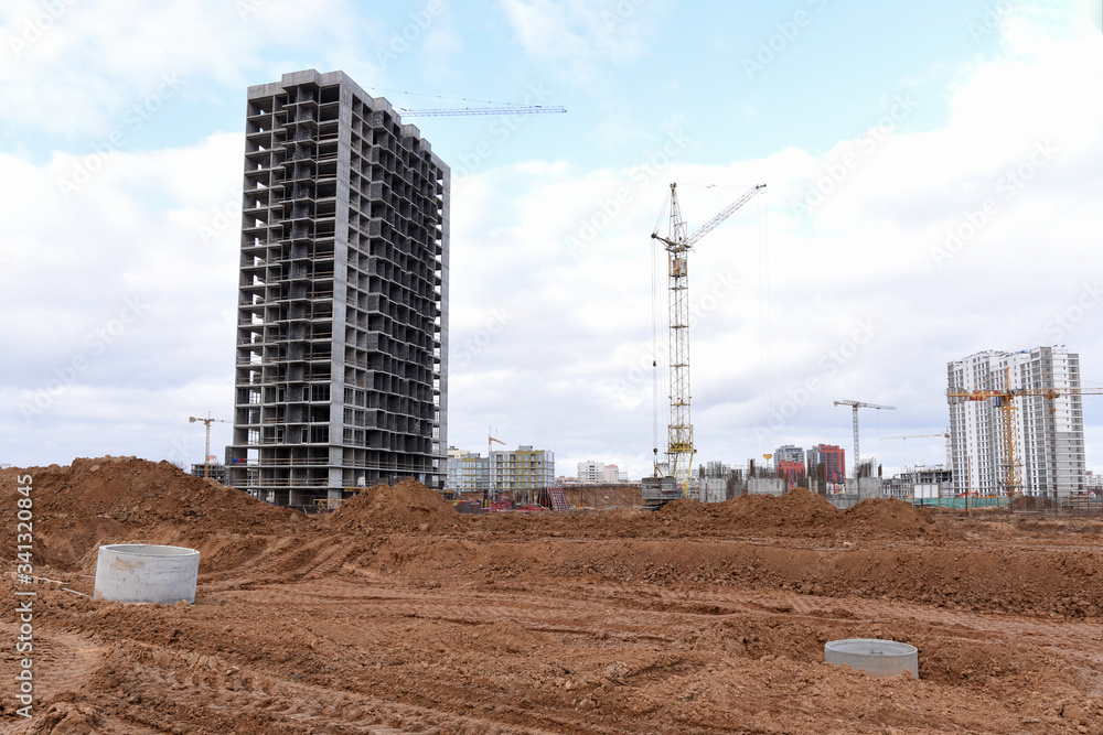 Tower cranes constructing new residential buildings at construction ...
