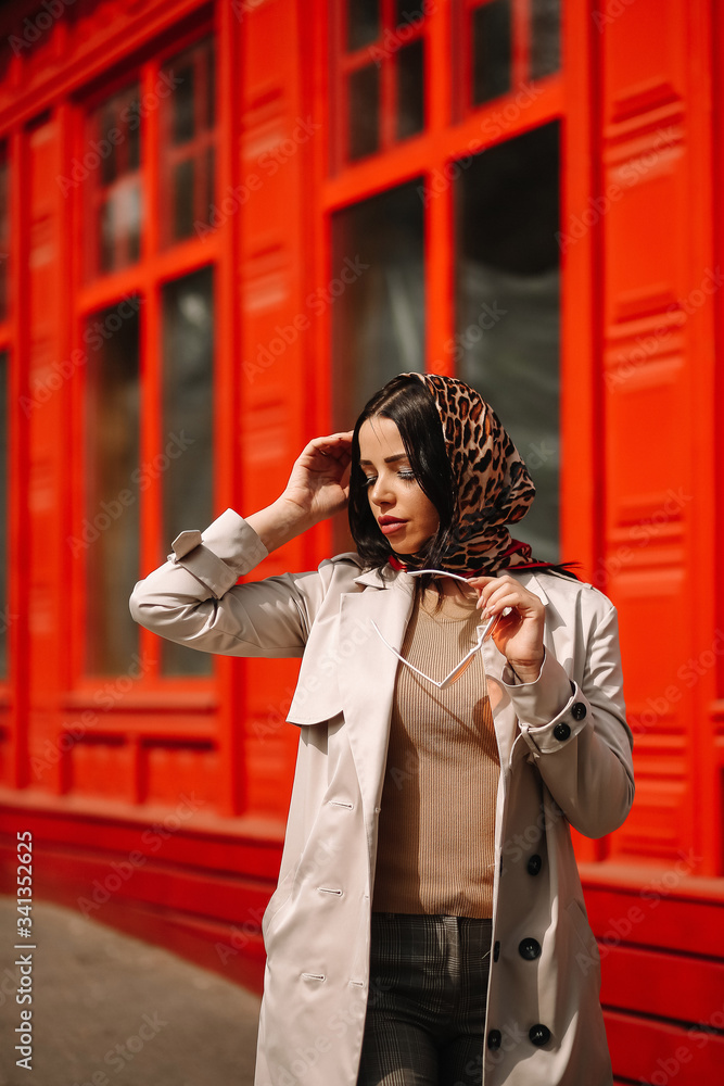 Beautiful young, sexy woman with red lips in a red cloak, dressed on ...