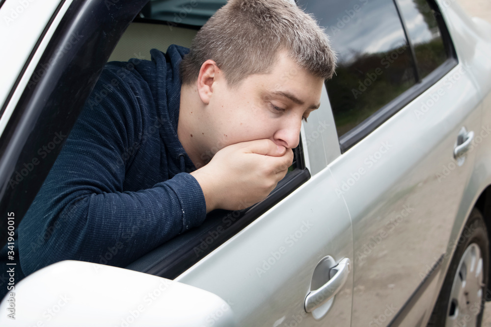 A ride during a car trip. The driver suffers from kinetosis, motion ...