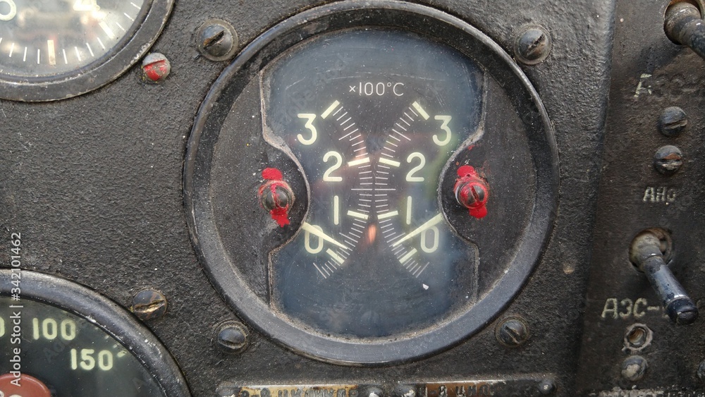 Aviation temperature indicator of the engine of the black panel of the ...