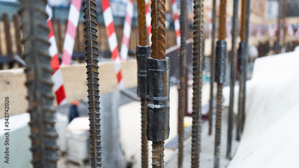 Construction, fittings, excavator, workers in suits, fastening fittings ...