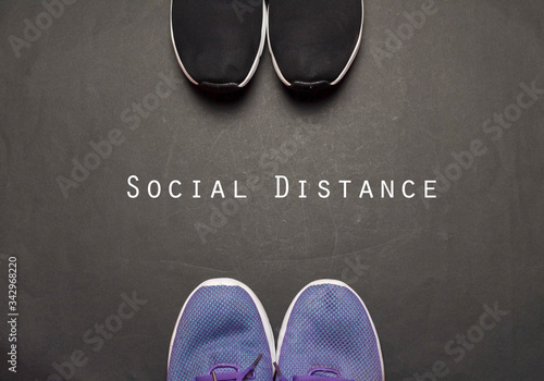 Social distancing concept. Shoes with text Social Distance. This image ...