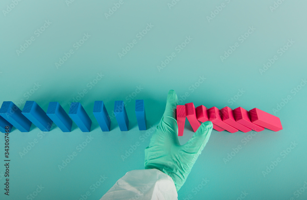 Concept of covid19 coronavirus pandemic with falling chain like a domino game. Contagion and ...