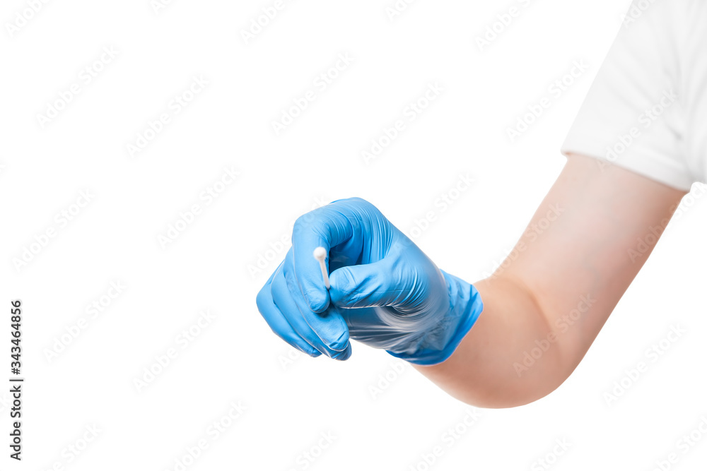 doctor arm in a blue sterile glove hold to give cotton swab for ...