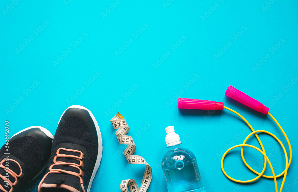 Set of fitness equipment over turquoise blue backgound.Workout objects ...