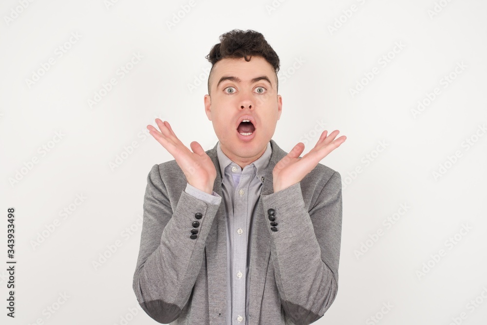 Surprise concept. Portrait of astonished handsome young man looking ...