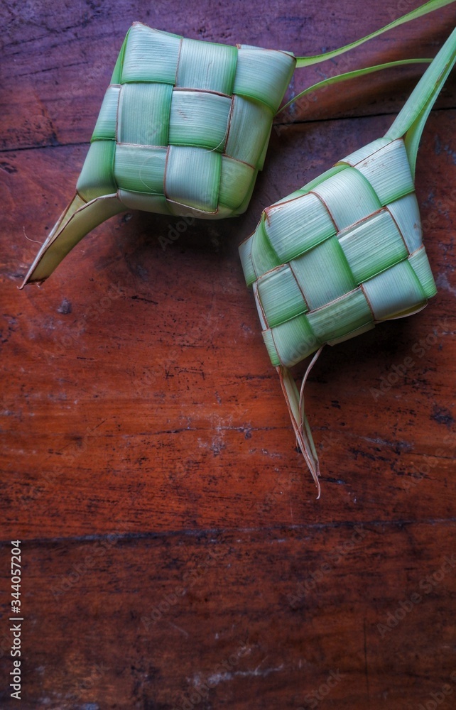 ketupat is a type of dumpling made from rice packed inside a diamond ...