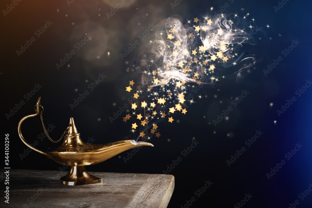 Genie appearing from magic lamp of wishes. Fairy tale Stock Photo ...