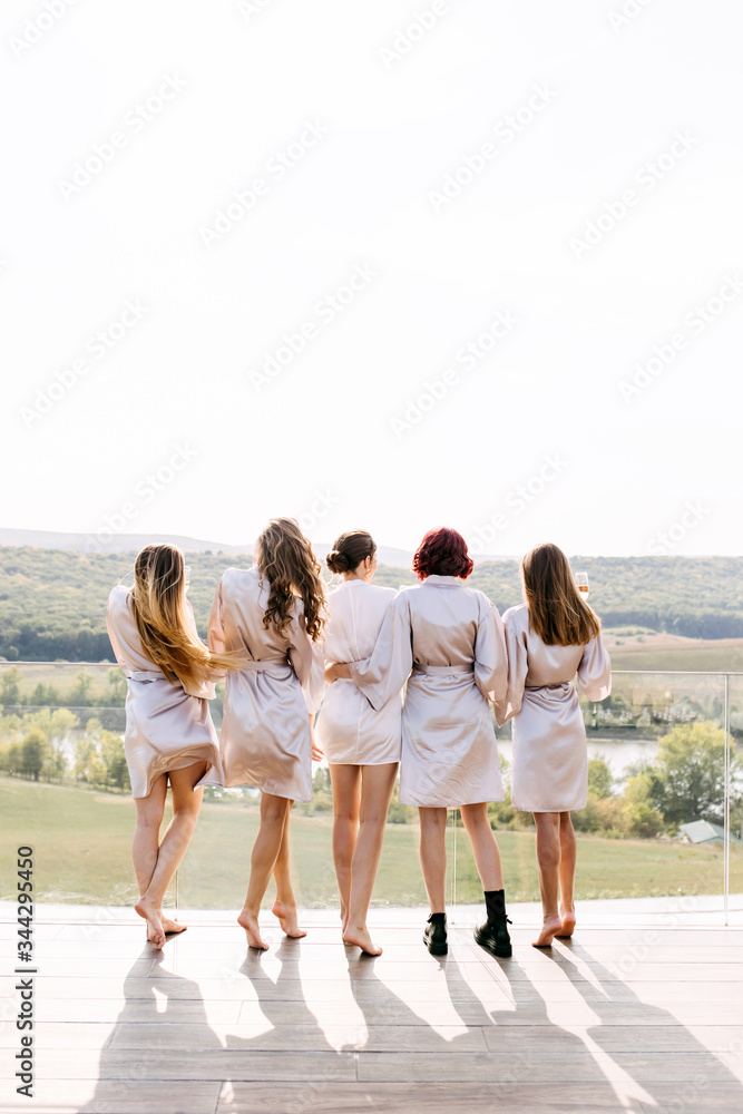 Barefoot girls having fun at a pyjama party. Bridesmaids on bridal ...