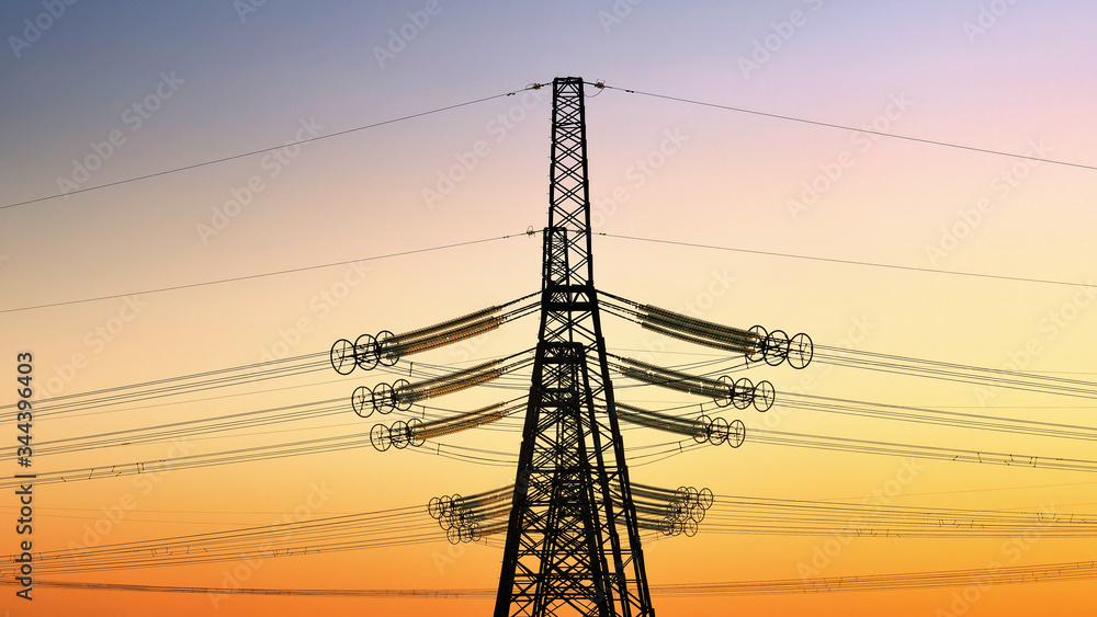 High voltage electric tower on sunset time. sunset sky background ...