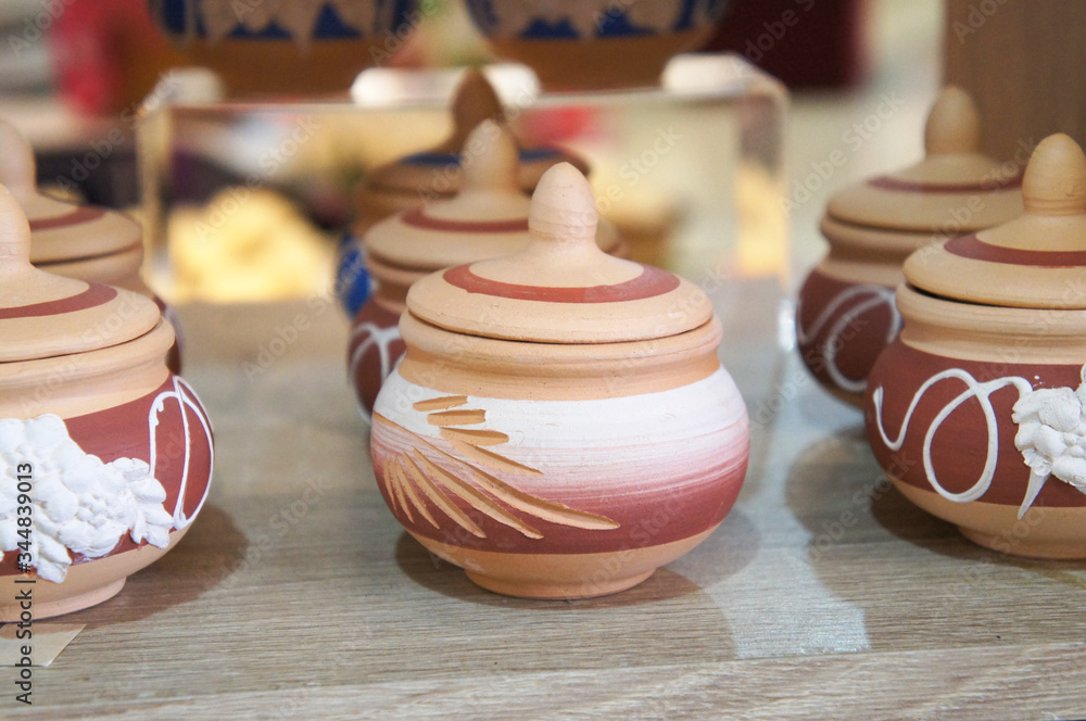 Traditional Malaysian pottery that has been commercialized. Decorated ...