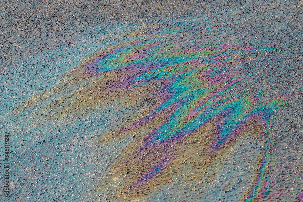 Fuel spill on a ground. Petroleum pollution is toxic for environment ...