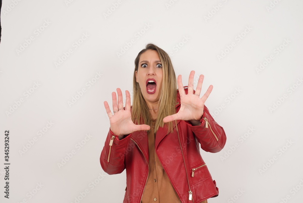 Dissatisfied female model frowns face, has disgusting expression, shows ...