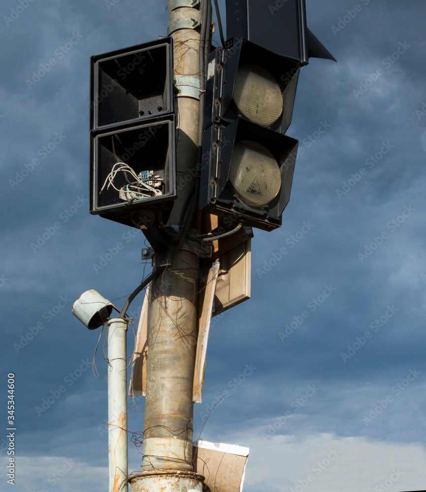 Broken traffic lights on the post. Stock Photo | Adobe Stock