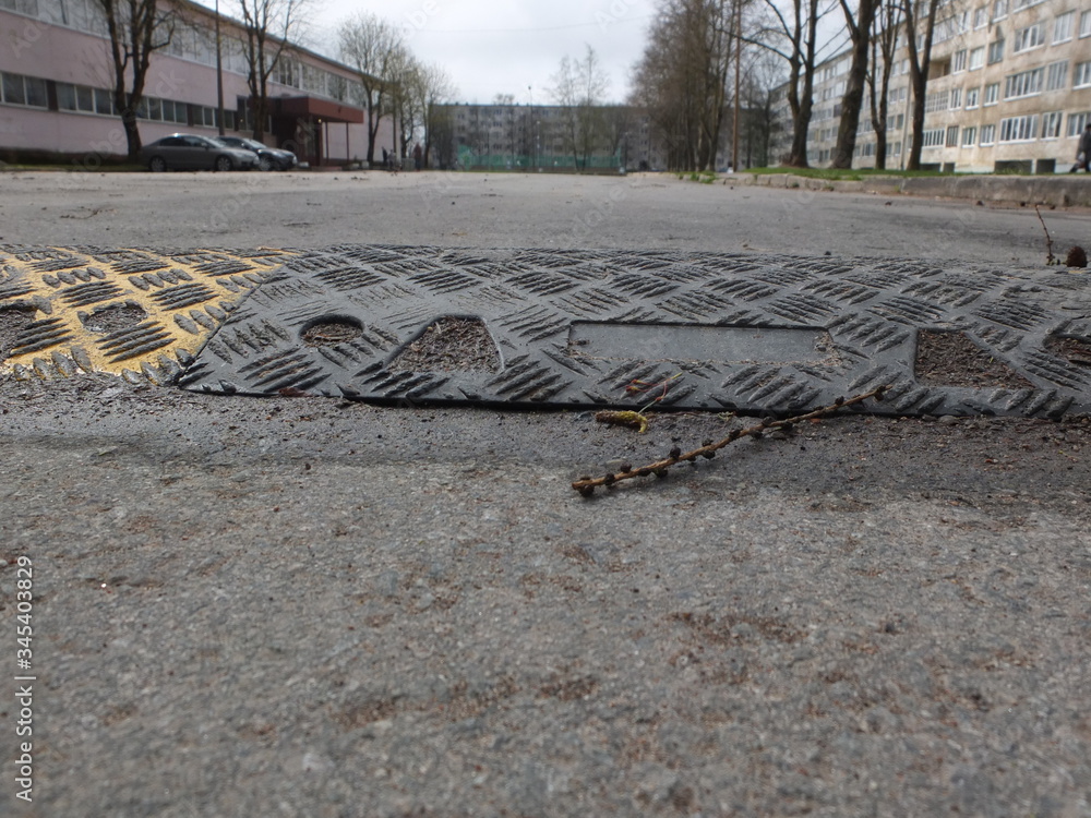 Speed bumps on the road. Sleeping policeman. Stock Photo | Adobe Stock