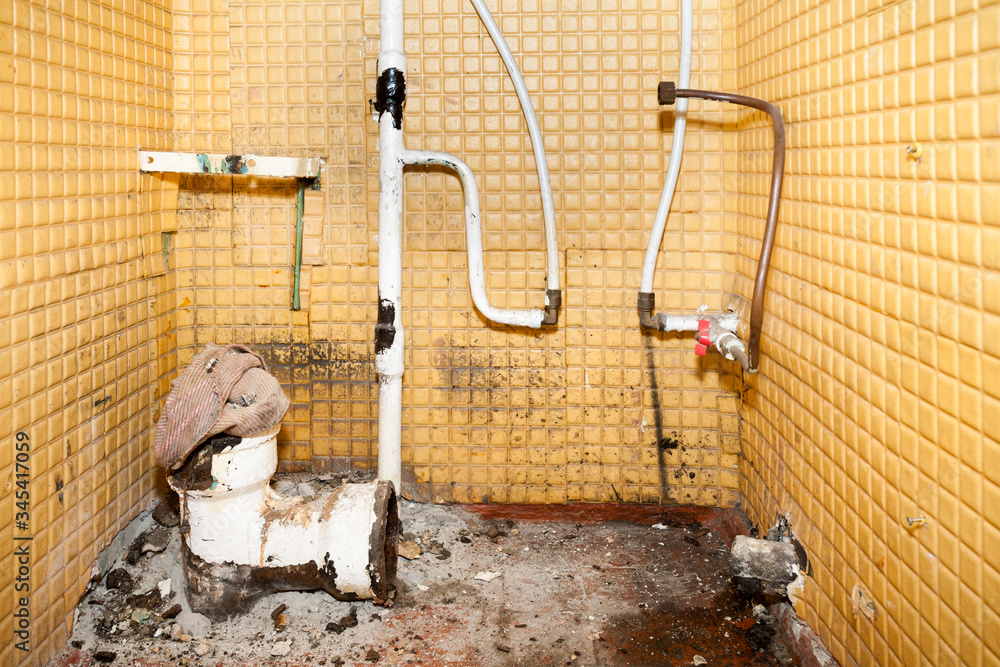 Fotografie Dismantling and replacing worn-out old sewer pipes in an ...