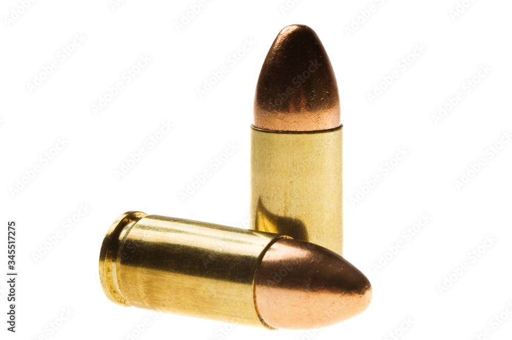 Shiny 9 mm caliber Bullets. Close-up of a 9mm full metal jacket ammo ... Shiny 9 mm caliber Bullets. Close-up of a 9mm full metal jacket ammo ...