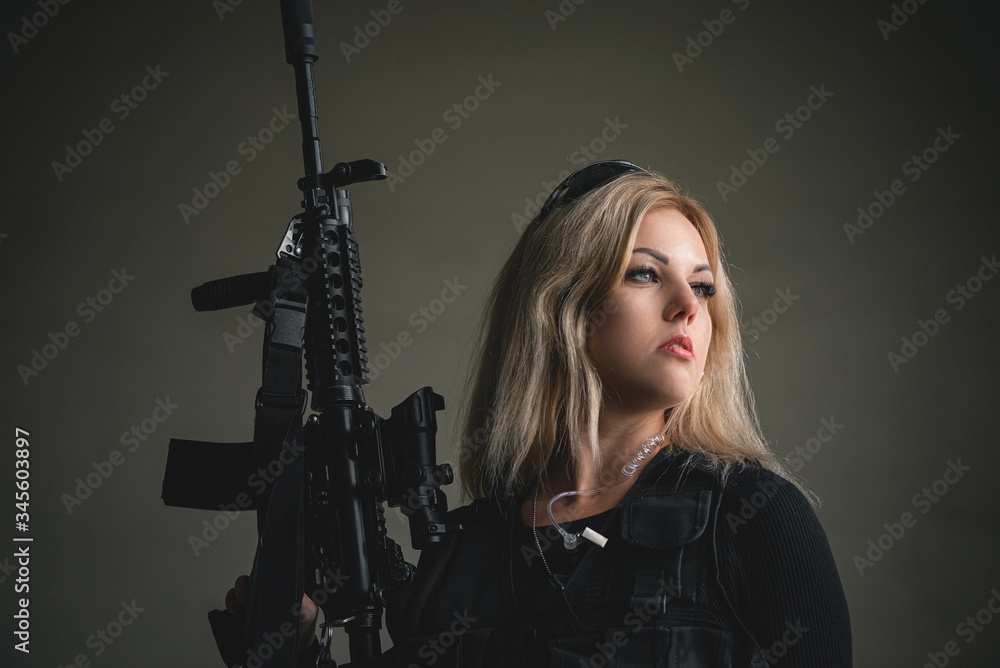 Special force agent girl with a rifle concept. Stock Photo | Adobe Stock