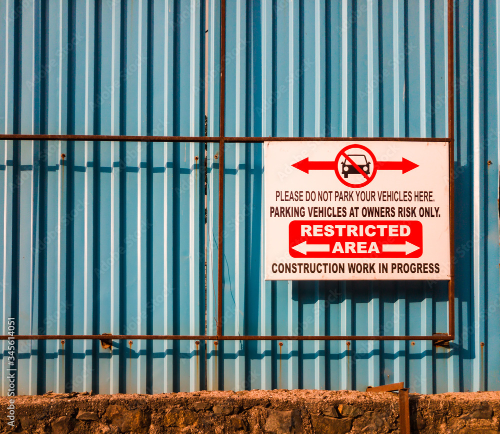A barricade around a construction site in suburban Mumbai with a ...