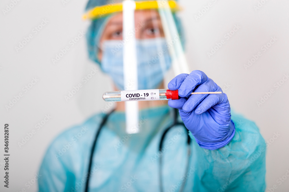 Lab technician holding swab collection kit,Coronavirus COVID-19 ...