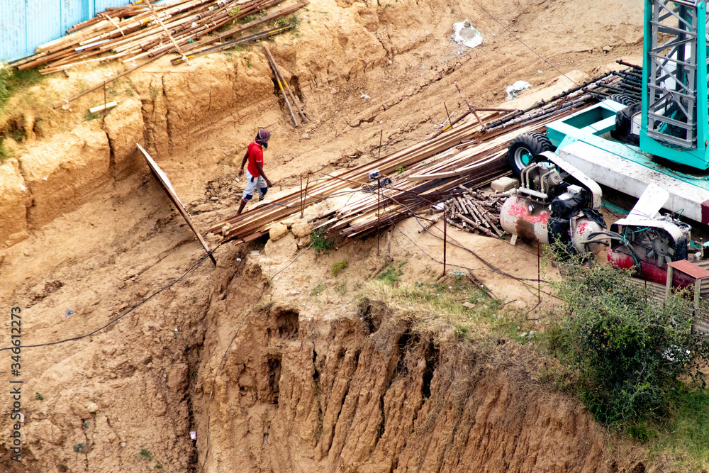 Stock-Foto „Construction worker barricading the ramp to a construction ...