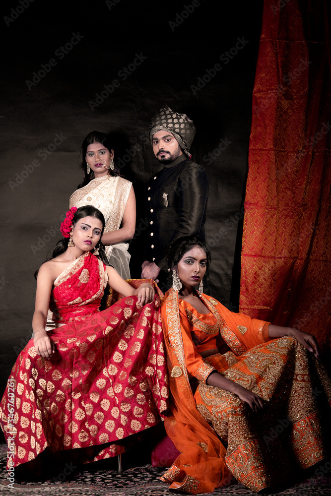 indian models in indian ethnic Saree, Lehenga and male model in a black ...