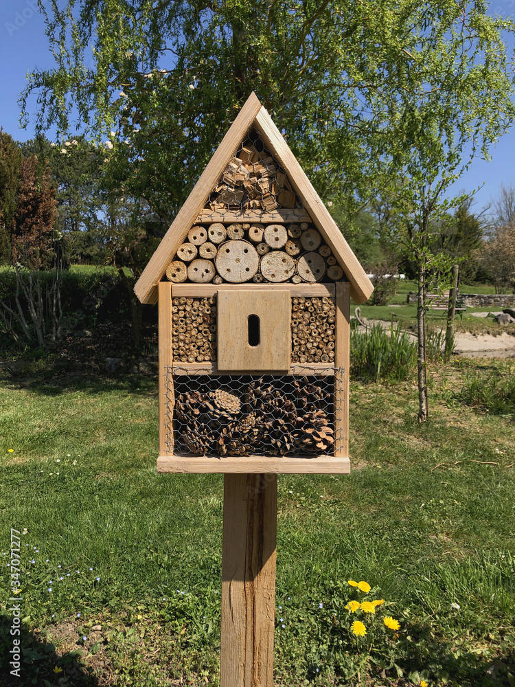 Insect hotel for gardens, wooden structure made to preserve the ...
