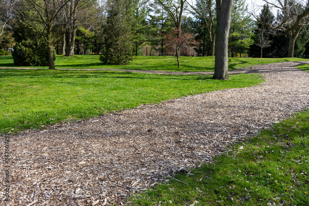 A wood chip mulched path in a park is a simple, low maintenance ...