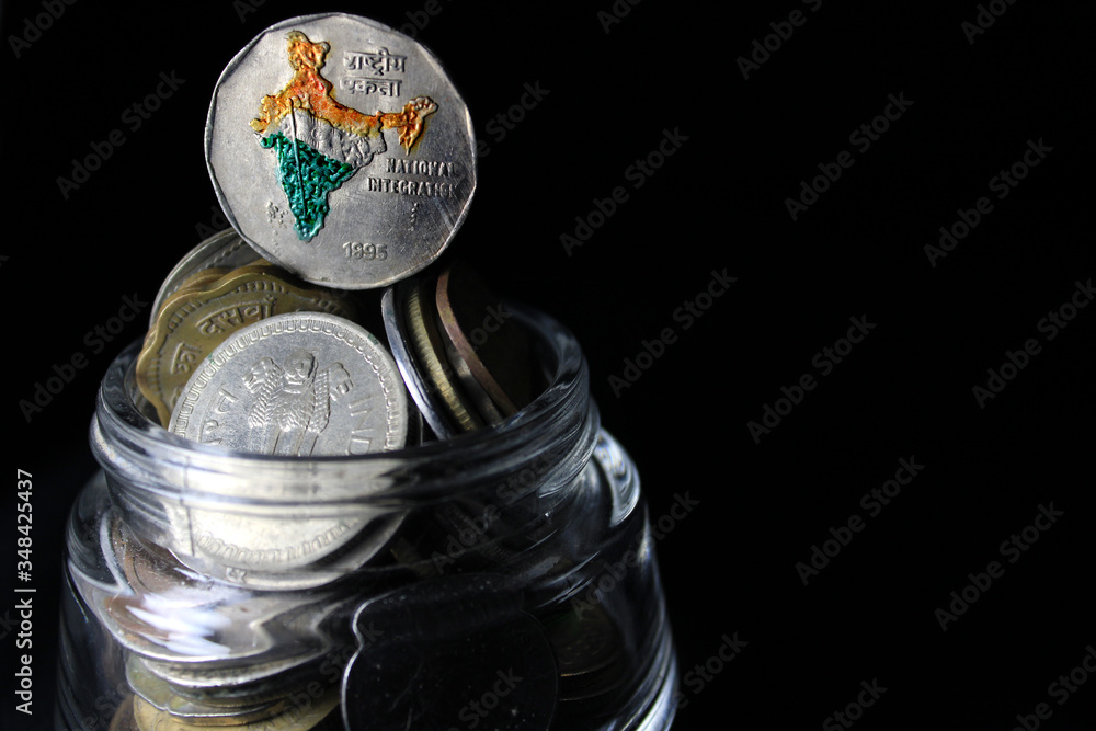 Two rupee coin of India isolated on black background. Map of India as a ...