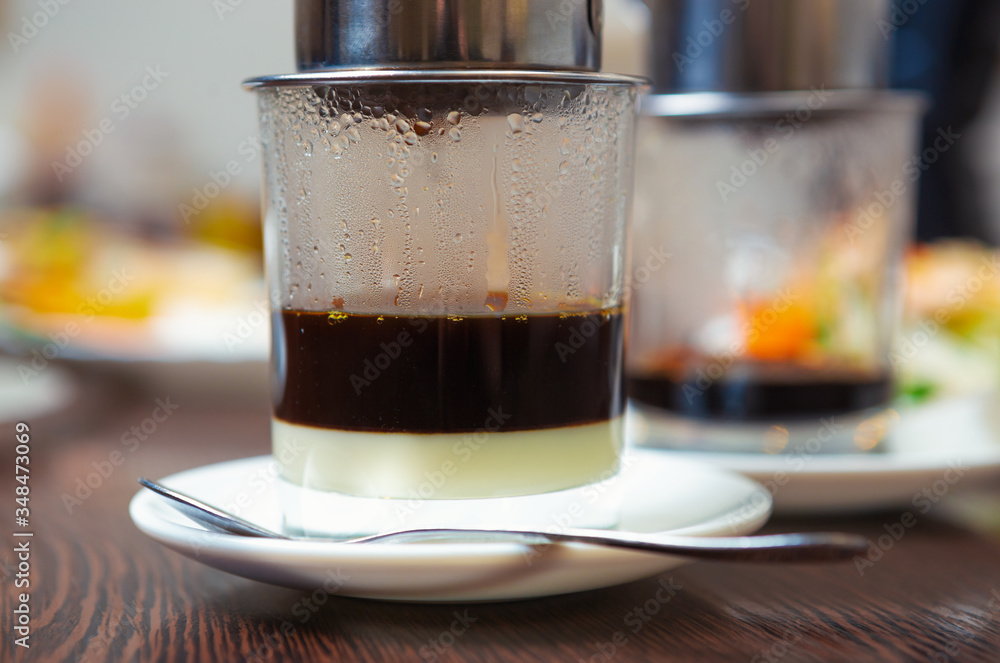 Photo Stock Traditional Vietnamese coffee with condensed milk brewing ...