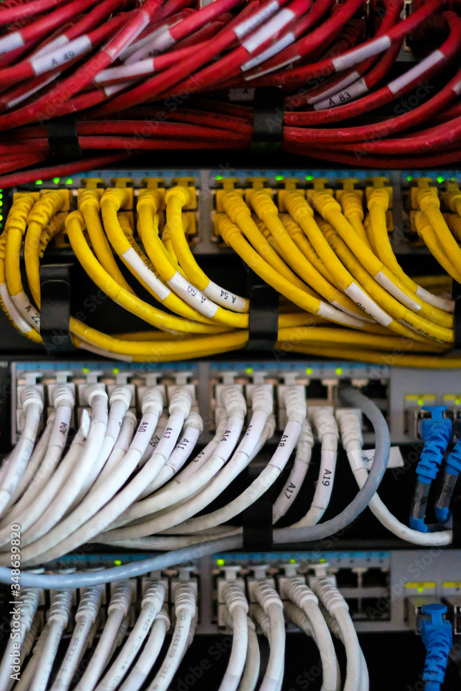 Network routers of ISP. Many wires connect to the network interfaces of ...