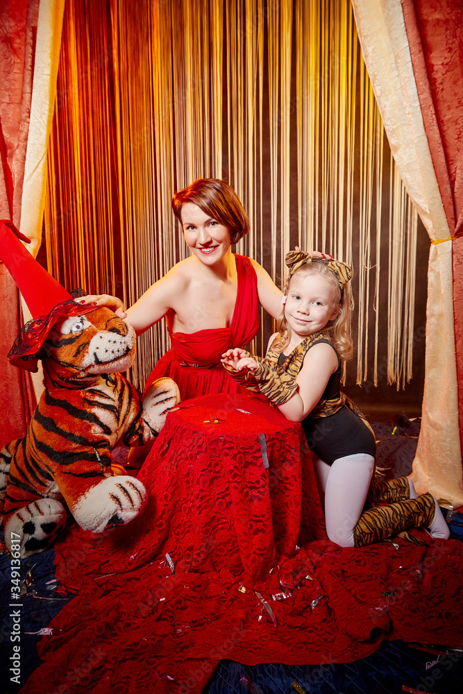 Family during a stylized theatrical circus photoshoot in a beautiful ...