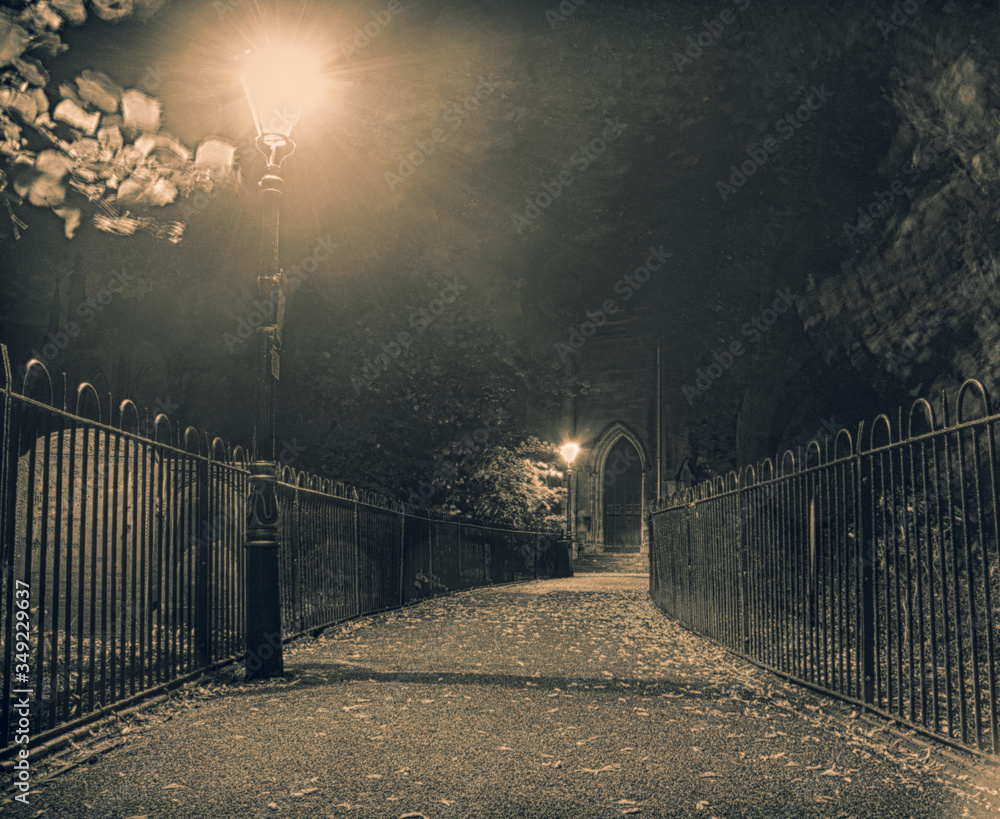 Mysterious and spooky alleyway path to gothic church door, horror and ...