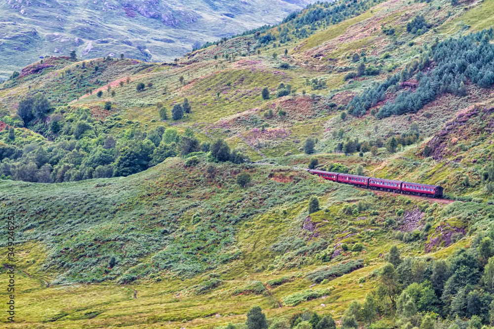 Jacobite steam express approaching Glenfinnan viaduct in Scotland ...