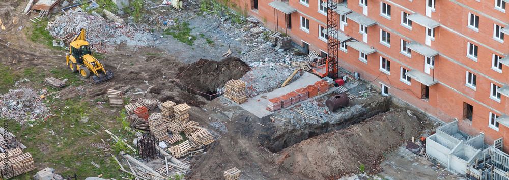 Dug out land with a yellow escalator - conducting communications to a ...