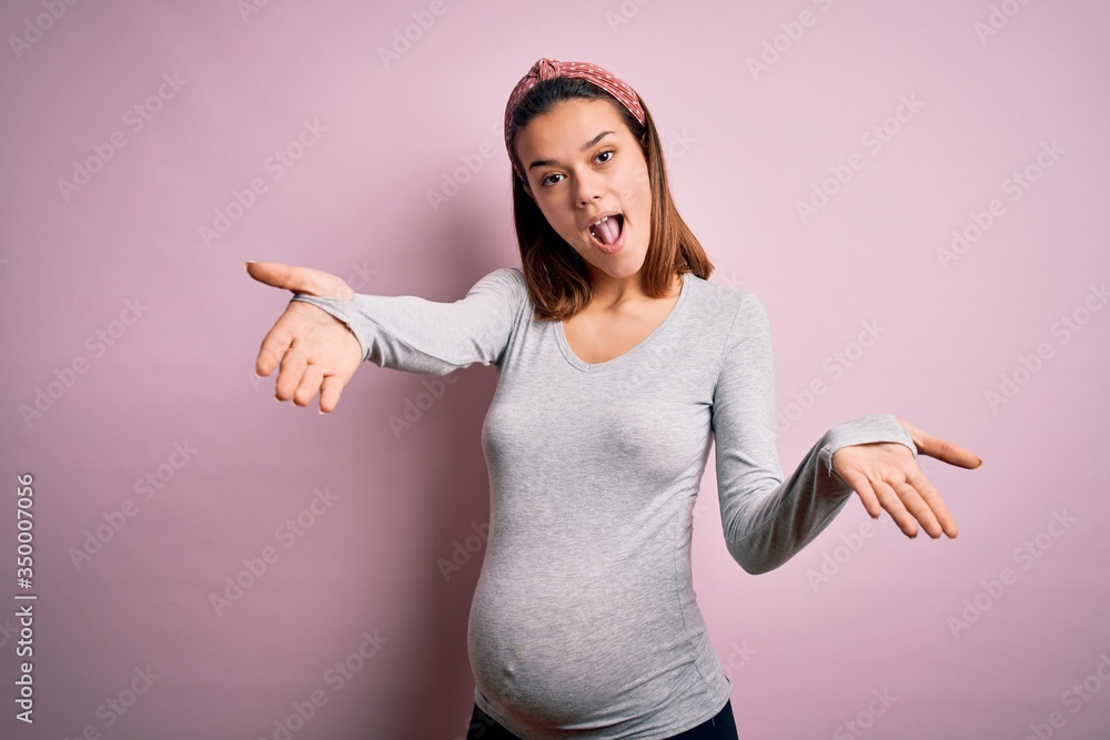 Young beautiful teenager girl pregnant expecting baby over isolated ...