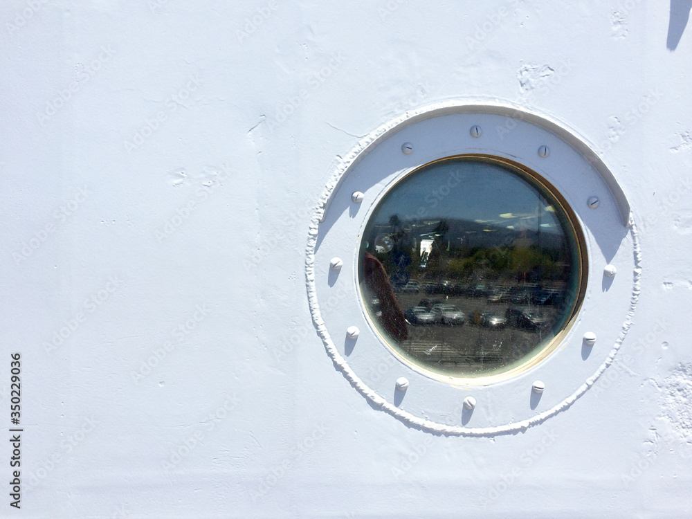 Porthole on metal ship with round circle glass on USS Iowa naval ...