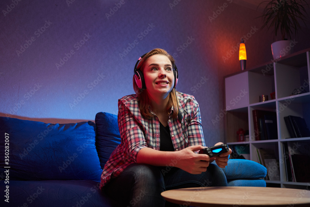 Portrait of crazy playful Gamer enjoying Playing Video Games on ...