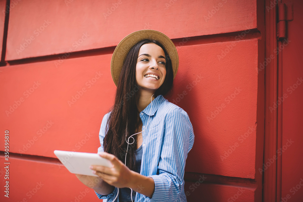 Prosperous sincerely female millennial with modern touch pad listening ...