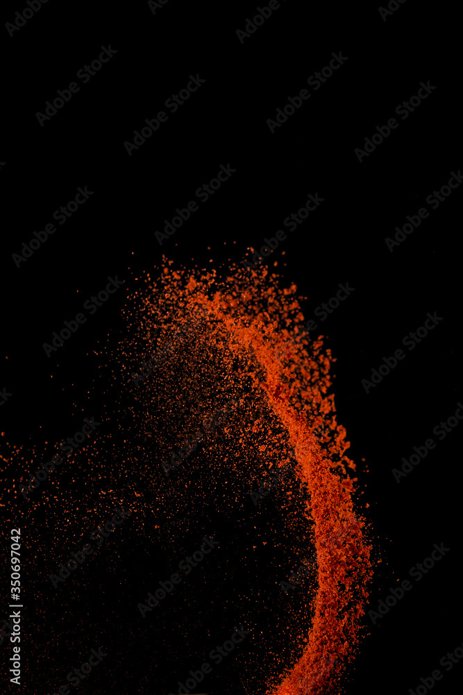 Red paprika spices powder explosion, flying chili pepper isolated on ...