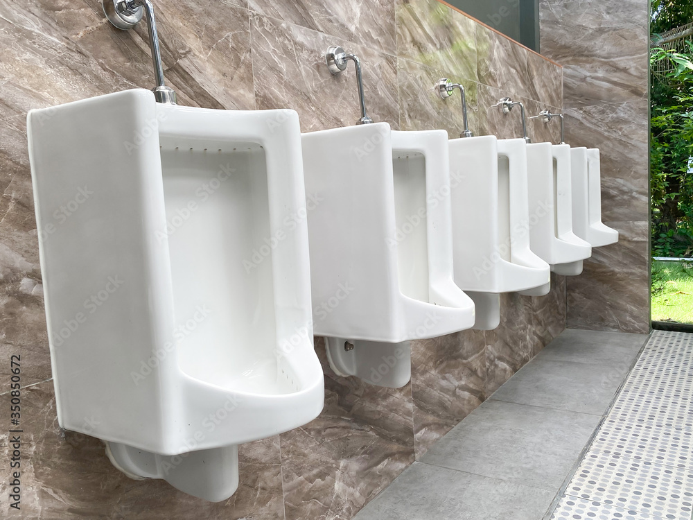 Men's white urinals design, Close up row of outdoor urinals men public ...