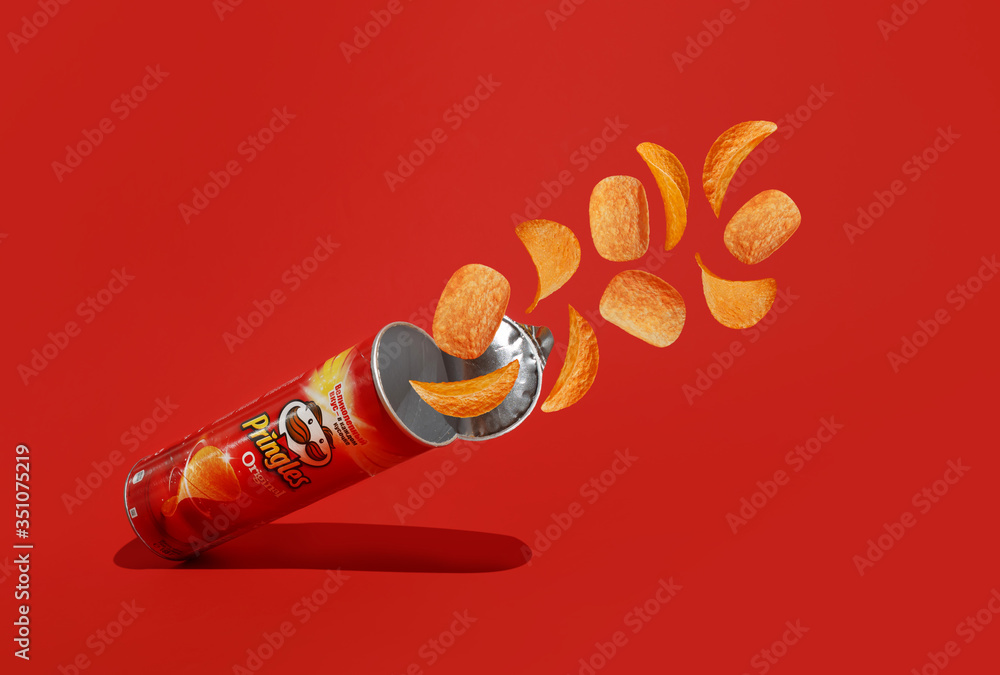 Kiev, Ukraine - May 21, 2020: open packaging of Pringles chips on a red ...
