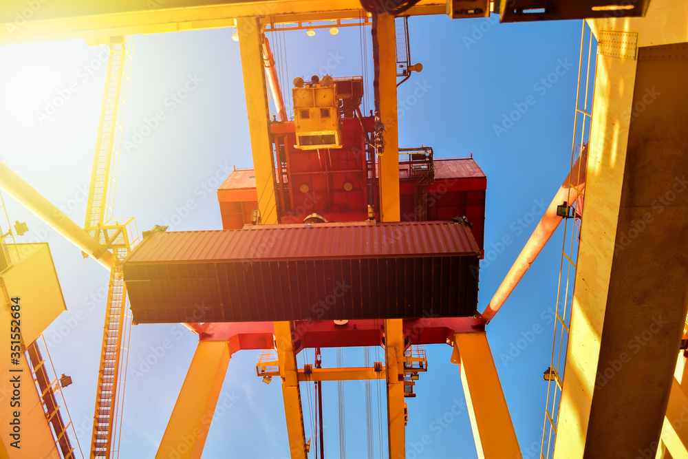 Container logistics, quay crane load and unload cargo container from vessel. Port operations ...