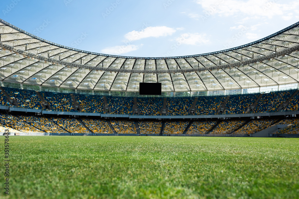grassy football pitch at stadium at sunny day with blue sky Stock Photo ...