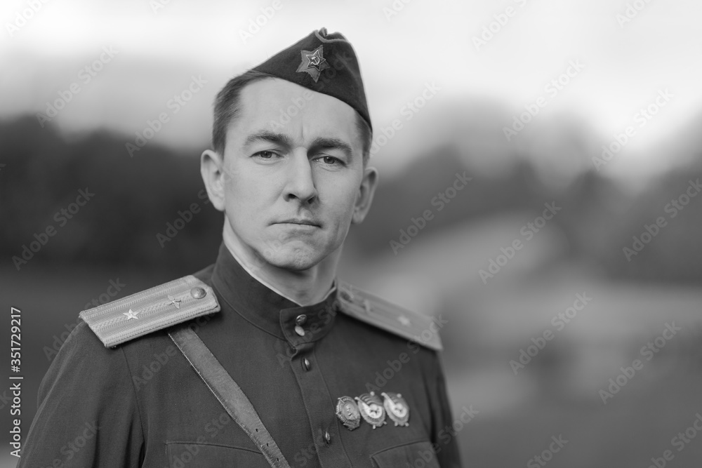 Retro style black and white photography. A young adult male pilot in ...