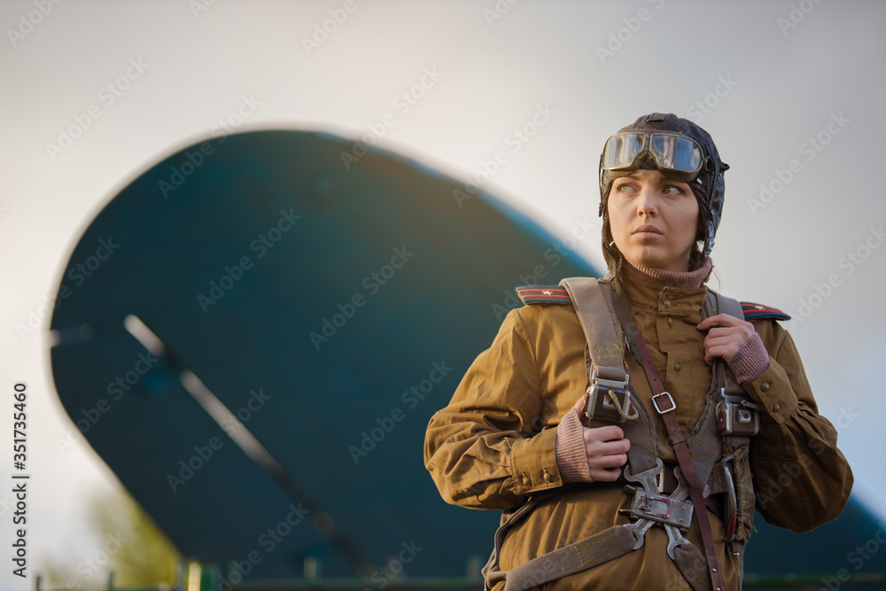 A young female pilot in uniform of Soviet Army pilots during the World ...