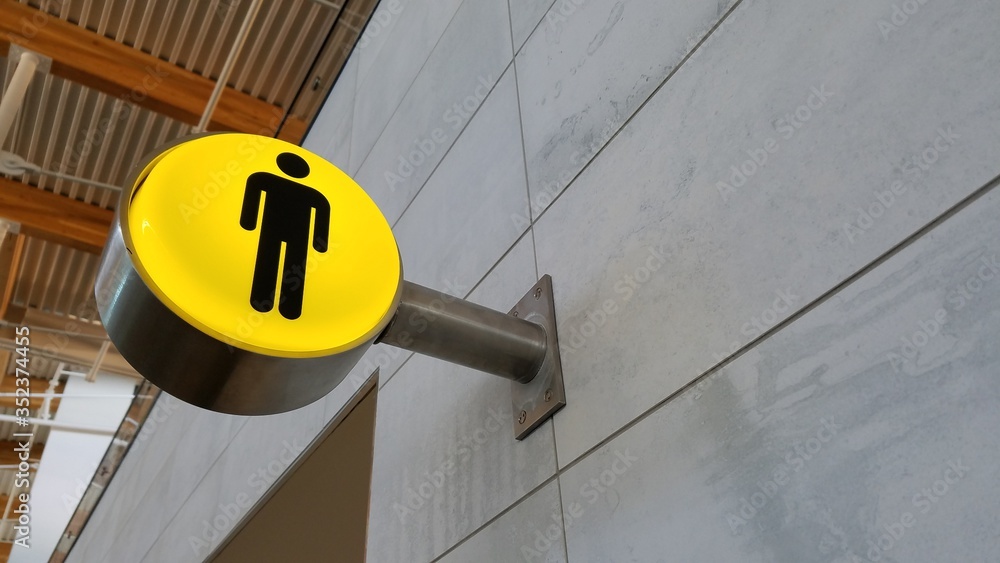 Signage for men restroom in public area Stock Photo | Adobe Stock