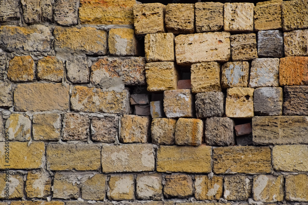 shadow from the blocks of limestone shell. Wall texture background ...