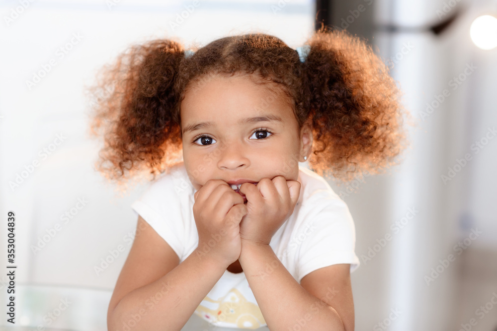 Head shot portrait healthy attractive mixed race little girl with curly ...